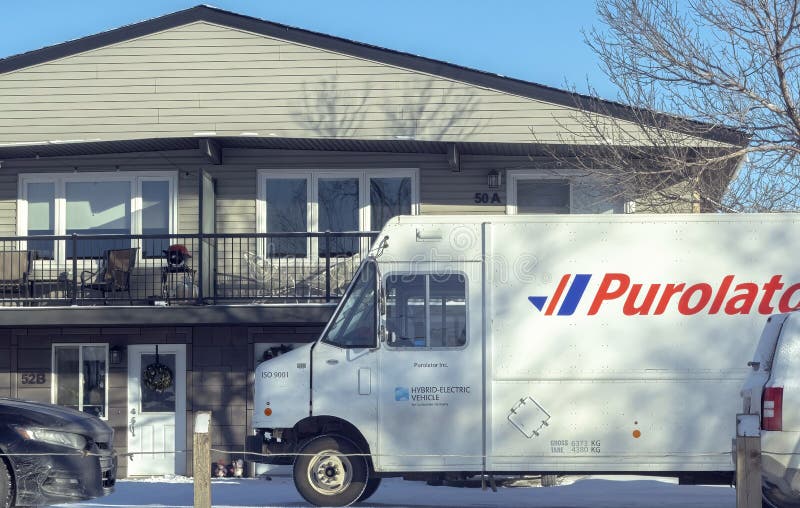 A Purolator Delivery Truck in Front of a House Editorial Image - Image ...