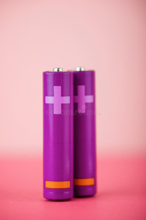 Purple AA Batteries on a Pink Table Stock Image - Image of little ...