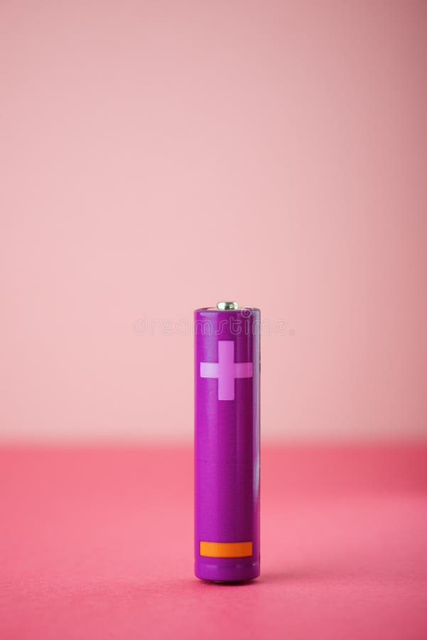 Purple AA Battery on a Pink Table Stock Photo - Image of electricity ...