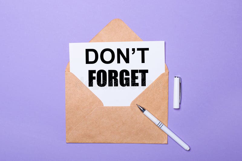 On a Purple Background, a White Pen, a Craft Envelope and a White Card ...