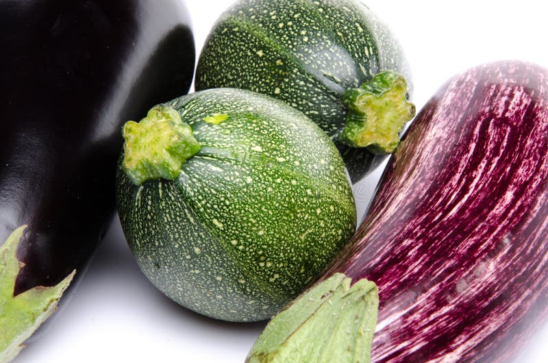Purple and Black Eggplant and Two Zucchini Stock Photo - Image of ...