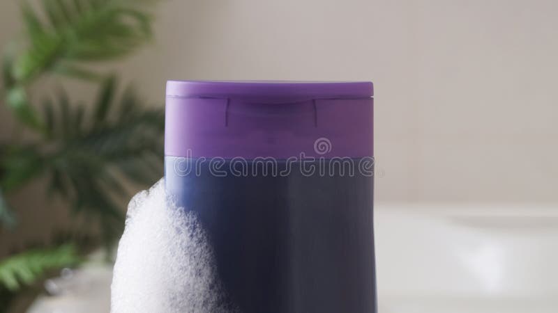 Purple Bottle of Bubble Bath with Foam Indoors, Closeup Stock Photo ...