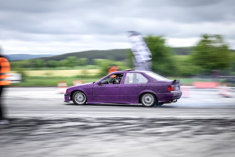 Purple Car Speeds on Race Tracks, with Blurred Motion Stock Photo ...