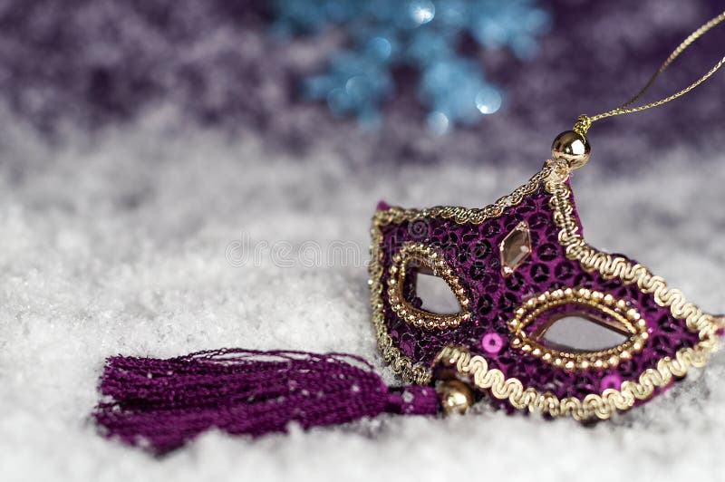 Purple Carnival Mask in the Snow Stock Photo - Image of emotion ...