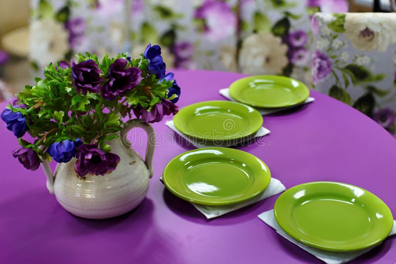 Purple Dining Table with Green Plates. Stock Image - Image of fine ...