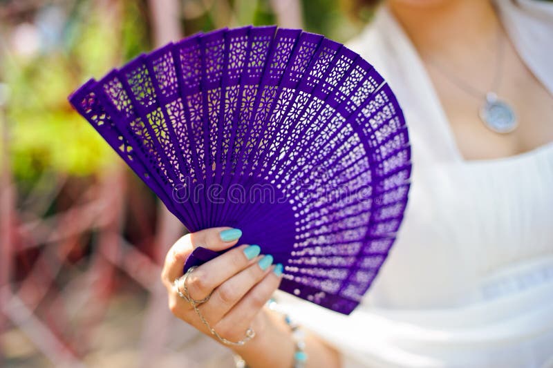 Purple fan at the bride stock photo. Image of accessory - 75581628
