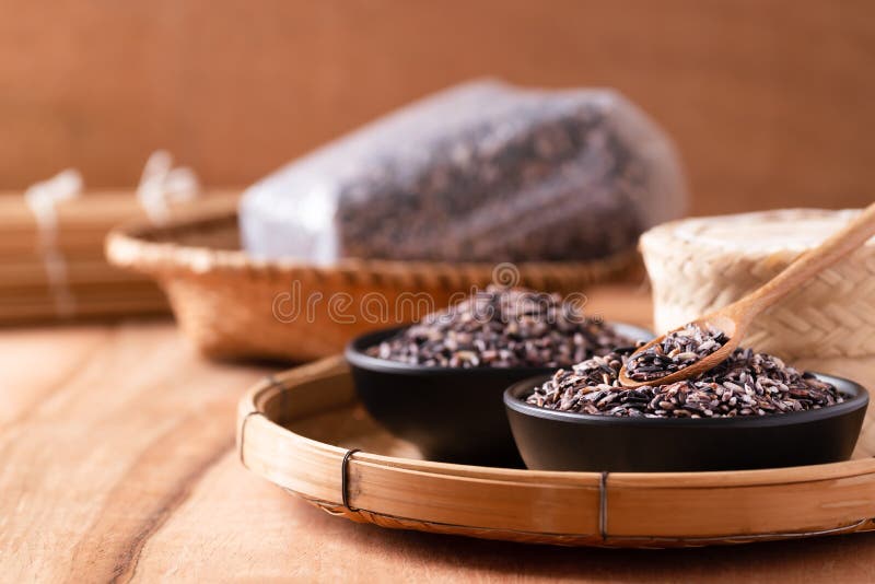 Thai Purple Glutinous Rice Grain in a Black Bowl with Spoon Stock Image ...