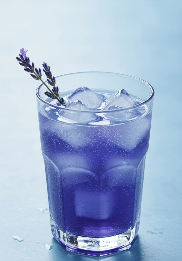 Purple Lavender Ice Drink in Glass on Blue Background Stock ...