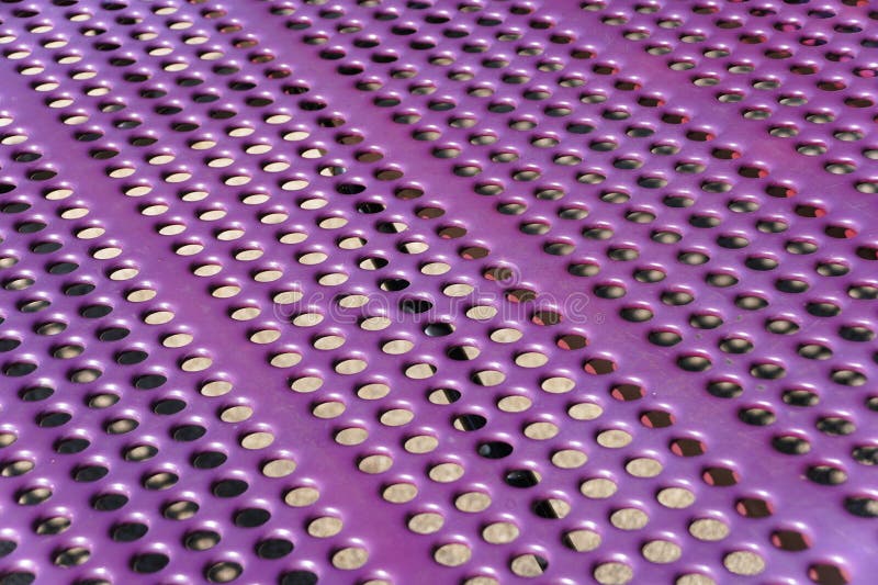Purple Metal Panel with Repeating Patterns of Oval Holes Stock ...