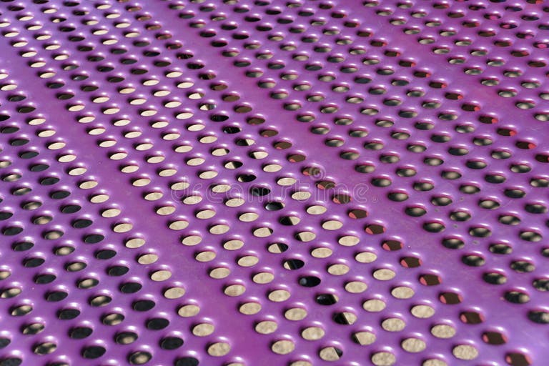Purple Metal Panel with Repeating Patterns of Oval Holes Stock ...