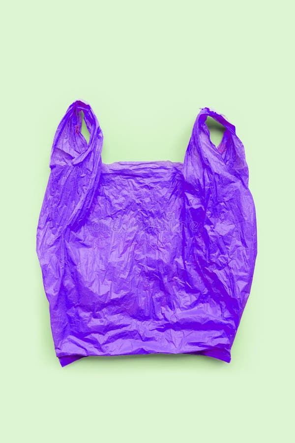 Purple Plastic Bag on Green Background. Environment Pollution Concept ...