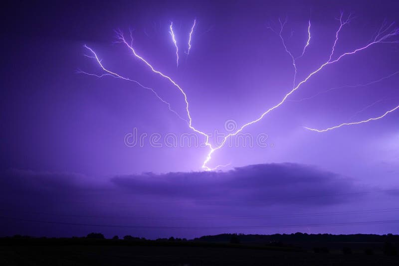 A Purple Sky with a Lightning Bolt in the Middle Stock Photo - Image of ...