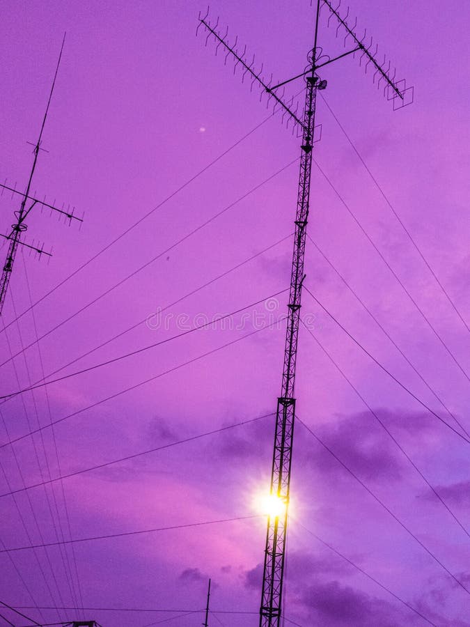 Purple Sky and only the Yellow Light between Towers Stock Image - Image ...