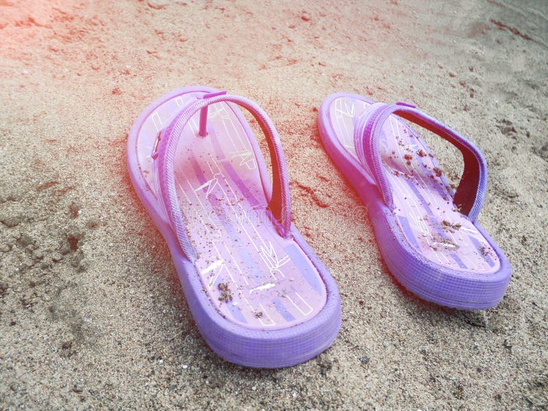 Purple Slippers on the Beach Sand. Close Up Stock Photo - Image of ...