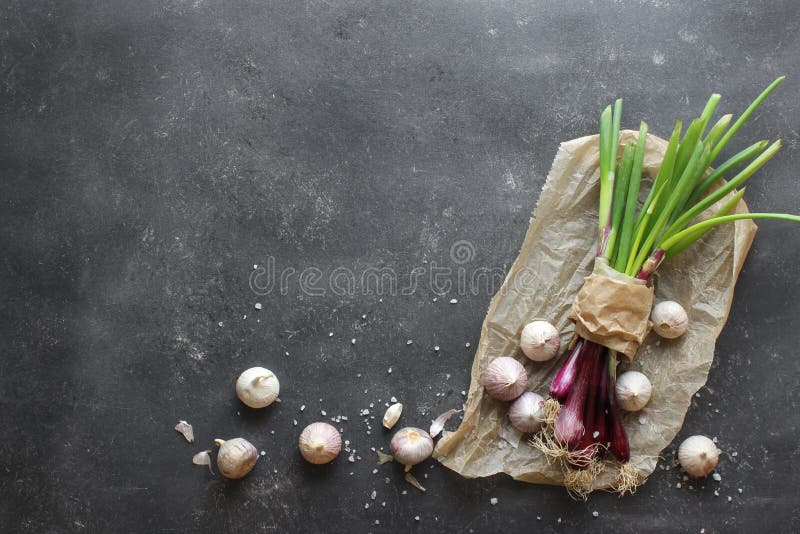 Purple Spring Onions on Dark Table Background Stock Photo - Image of ...