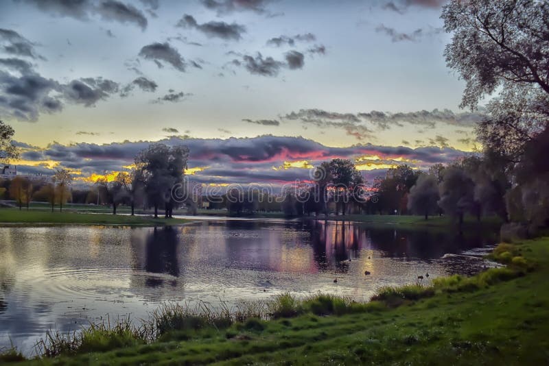 Purple Sunset Over a Pond in a Park Stock Image - Image of reflections ...
