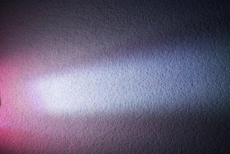 On a Purple Textural Background, a Bright Ray of Light and a Pink Glow ...