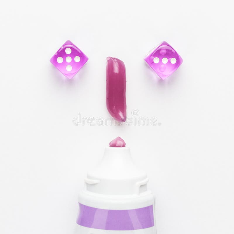Purple Toothpaste and Dices Forming Sad Smiley Stock Photo - Image of ...