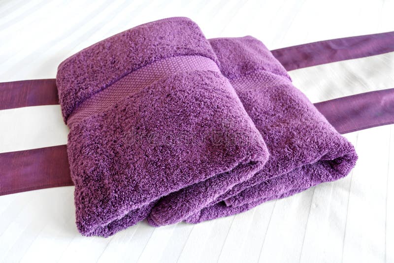 Purple Towels on the Bed Rooms Stock Photo - Image of dirt, bali: 29783654