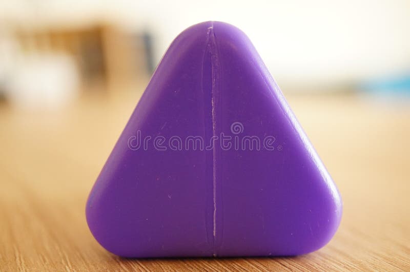 Purple triangle block stock photo. Image of plastic, object - 51875000