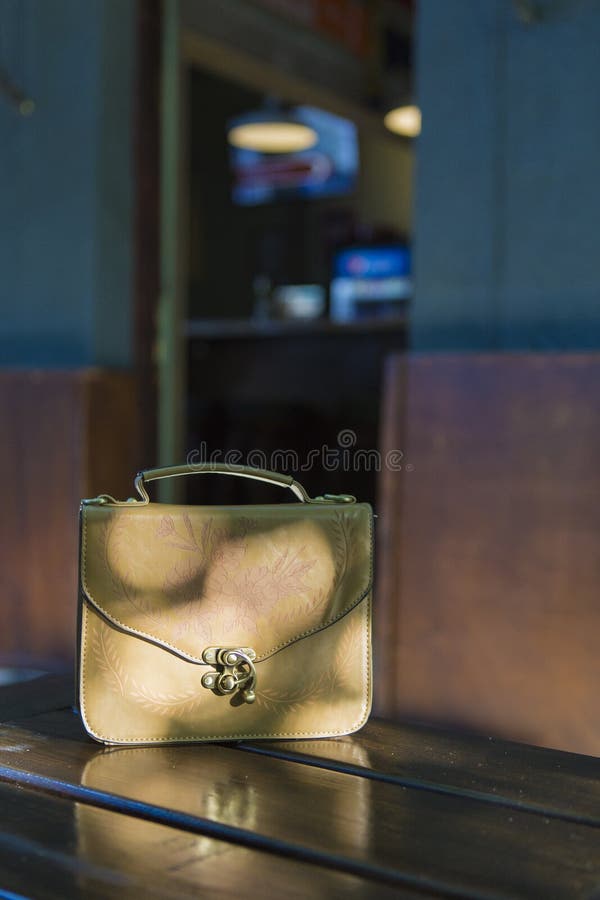 Purse on a Table and Her Reflection Stock Image - Image of fashion ...