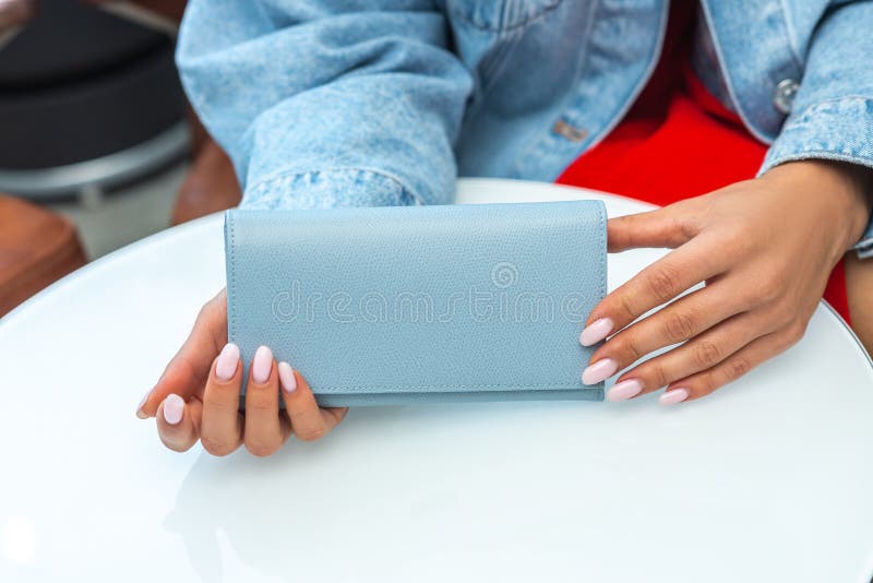 A Purse on a White Table in the Hands of a Lady Stock Image - Image of ...