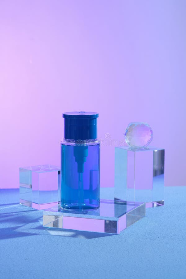 A Push Down Pump Dispenser Bottle Standing on a Glass Transparent ...