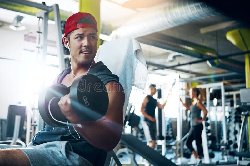 Push Harder Than Yesterday. a Man Doing a Upper-body Workout at the Gym ...