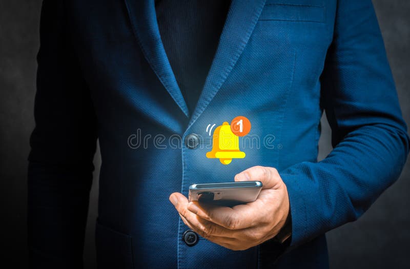 Push Notification. Businessman Holding Smartphone with Virtual Yellow ...