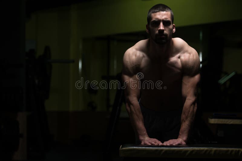 Push Ups on Bench in a Dark Room Stock Photo - Image of bench, energy ...