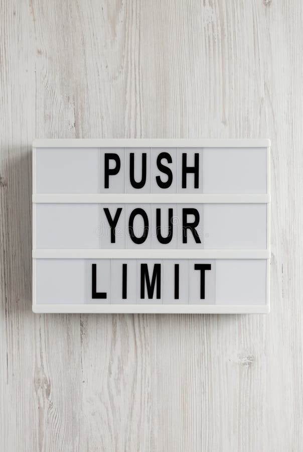 `Push Your Limit` Words on a Lightbox on a White Wooden Surface, Top ...