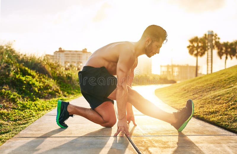 Push Yourself More with Every Workout. a Handsome Young Man Exercising ...