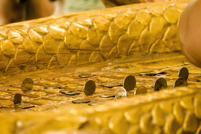 A coin placed on Buddha stock photo. Image of building - 122094236