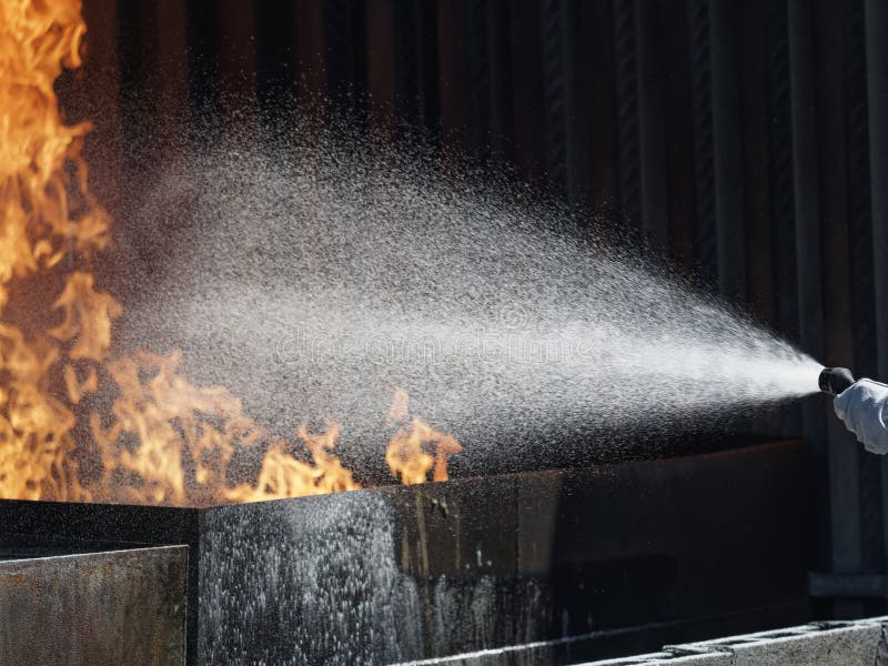Put Out a Fire during a Drill with a Powder Extinguisher Stock Image ...