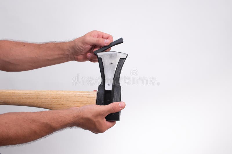 Men& X27;s Hands Put a Protective Case on the Axe Blade Stock Photo ...
