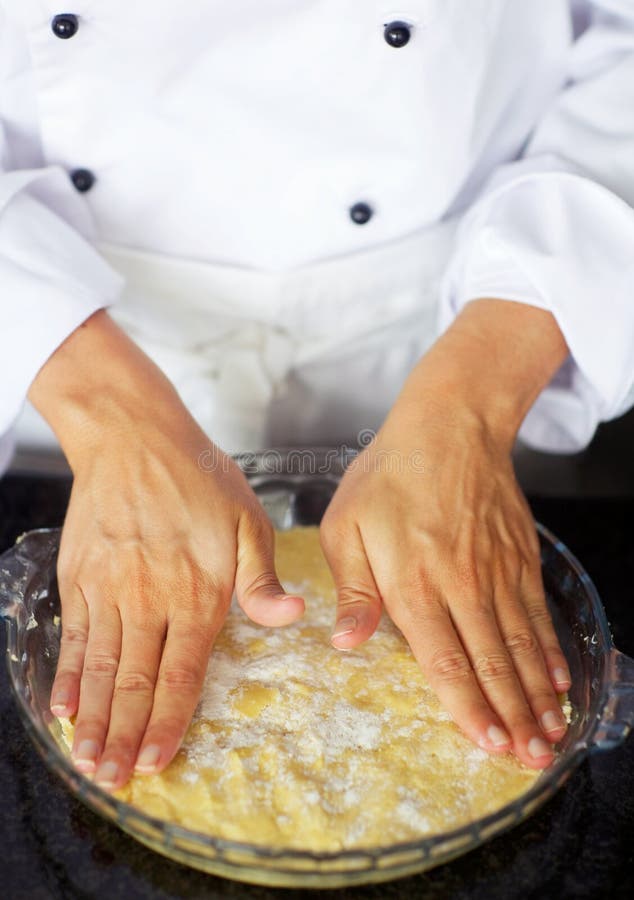 Put Some Work into it. a Baker Pressing Dough into a Pie Dish. Stock ...