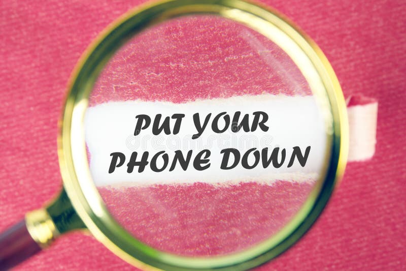 Put Your Phone Down Text through a Magnifying Glass Under a Torn Piece ...