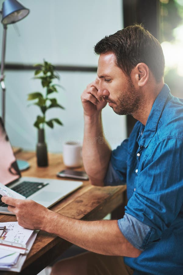 He always Puts a Lot of Thought into His Work. a Businessman Reading ...