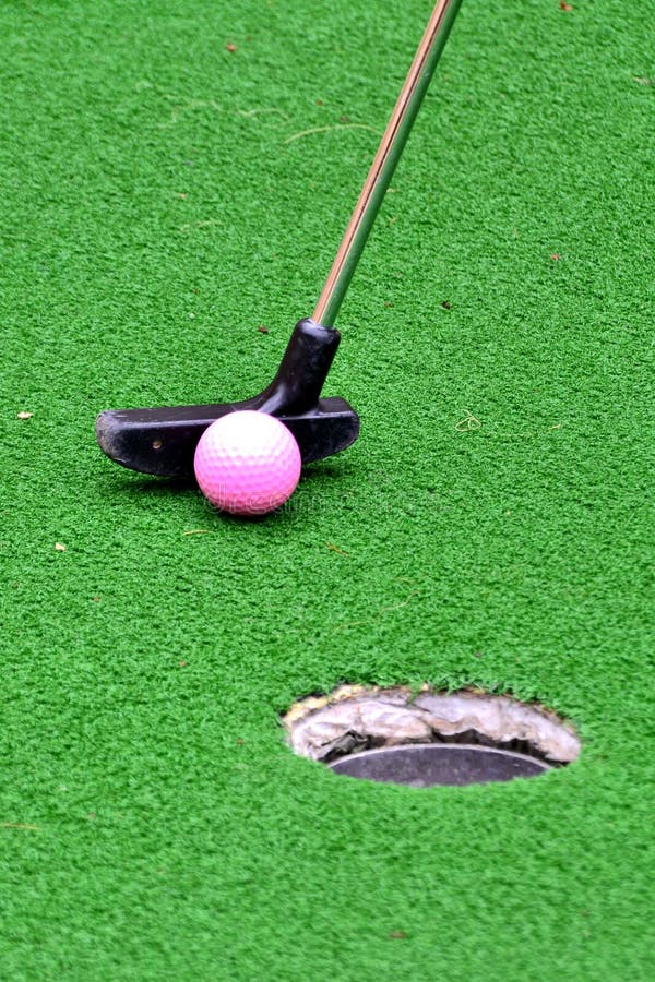 Putter Hitting a Pink Golf Ball Stock Photo - Image of coloured ...