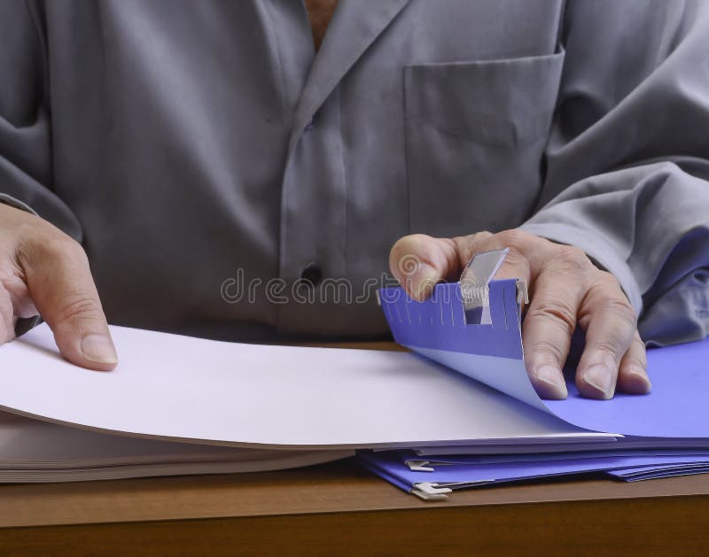 Putting Away Paper in a Folder for Organization ,work,order and Future ...