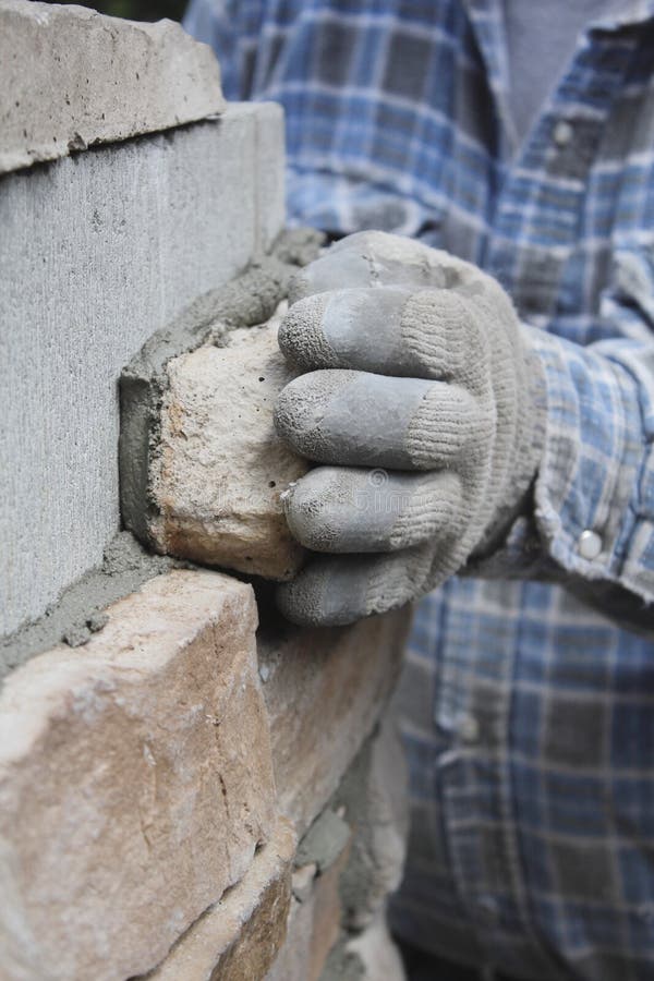 Putting Brick in Place stock image. Image of detail, tools - 33390347