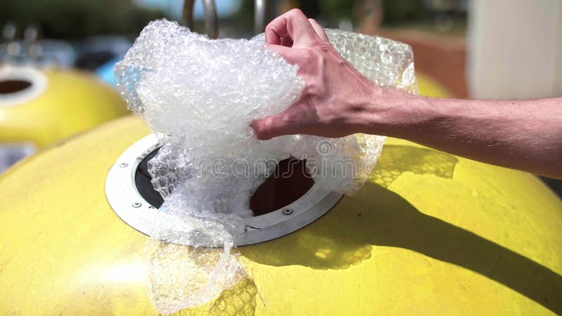 Putting Bubble Wrap into Recycling Bin Stock Video - Video of recycling ...
