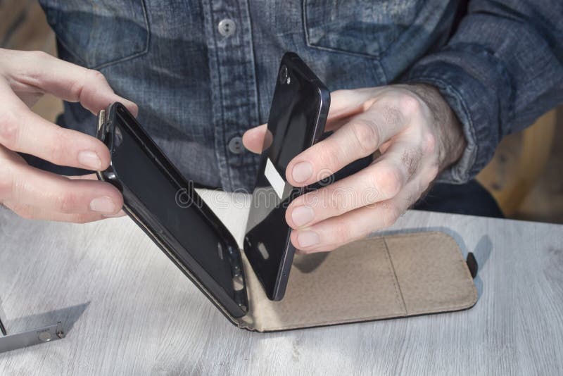 Putting the Case on the Back of the Mobile Phone. Stock Photo - Image ...
