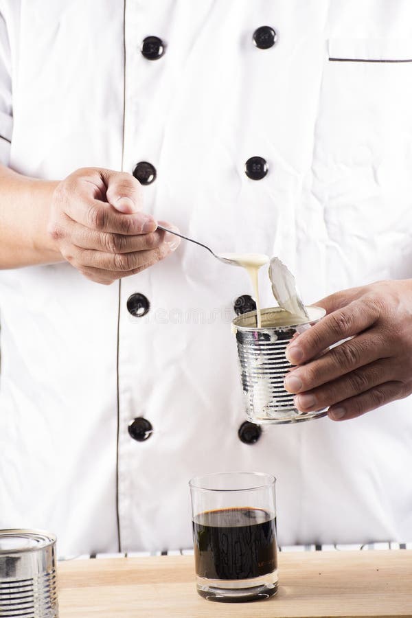 Putting Condensed Milk in To Hot Coffee Stock Photo - Image of cream ...