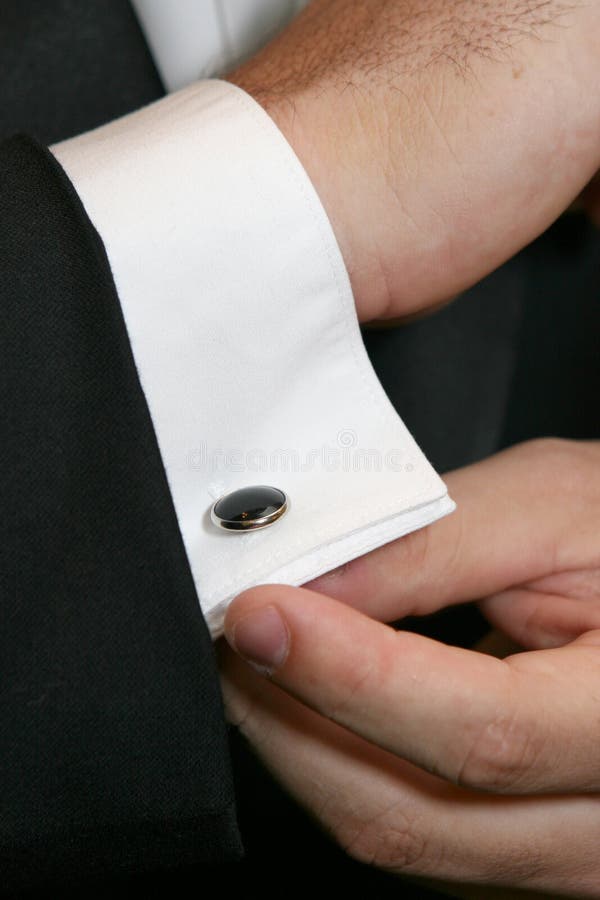 Putting on Cuff Links stock image. Image of caucasian - 7425135