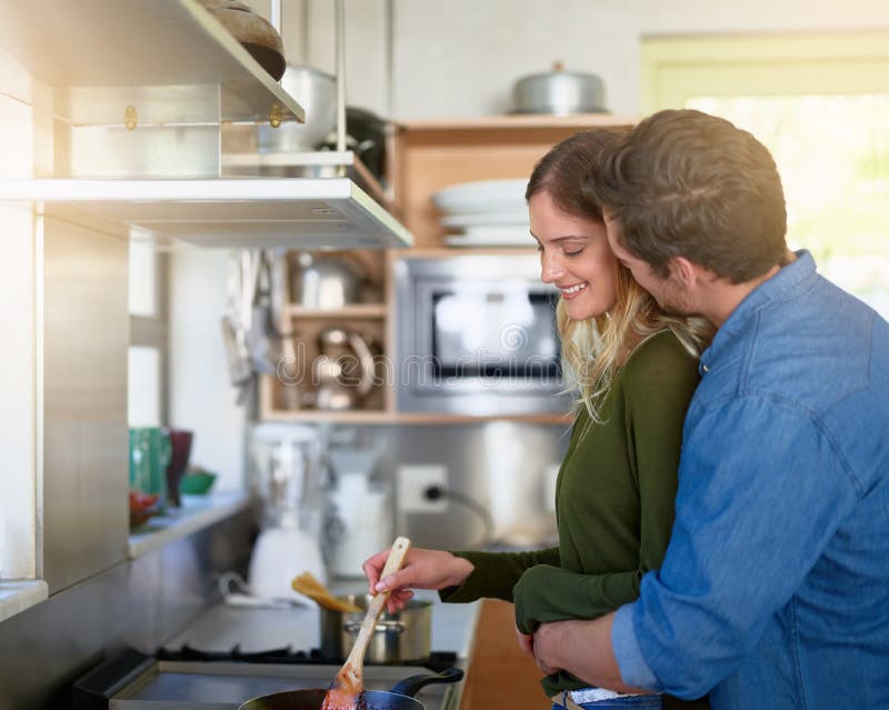 Putting a Dash of Love into Dinner. an Affectionate Young Couple ...