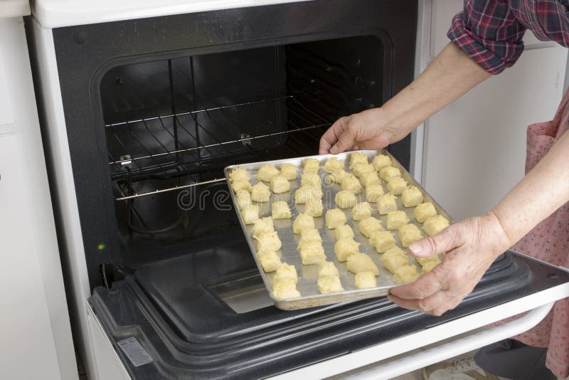 Putting Dough with Cheese in Oven (Recipe Series) Stock Image - Image ...