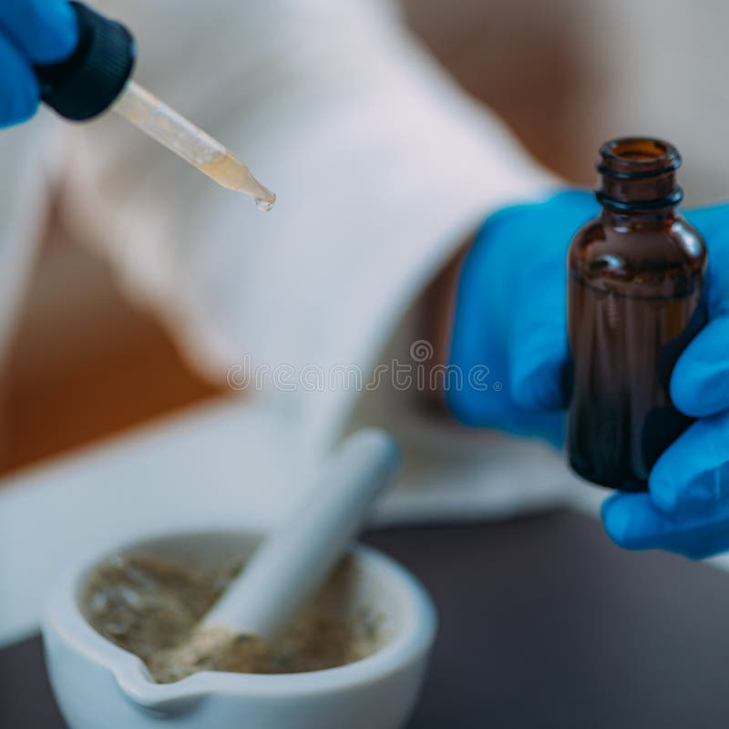 Putting Essential Oil Drops in Natural Face Cream Stock Photo - Image ...