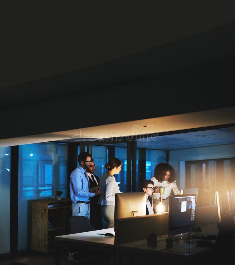 Putting in Extra Time To Meet the Deadline on Time. Colleagues Standing ...