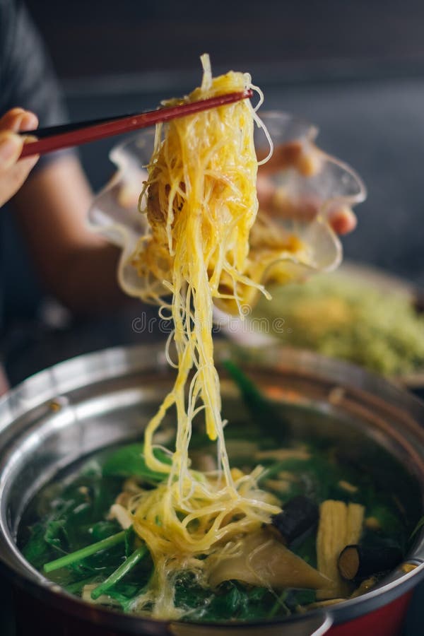 Putting Grass Noodle in the Suki Pot Stock Image - Image of food, grass ...